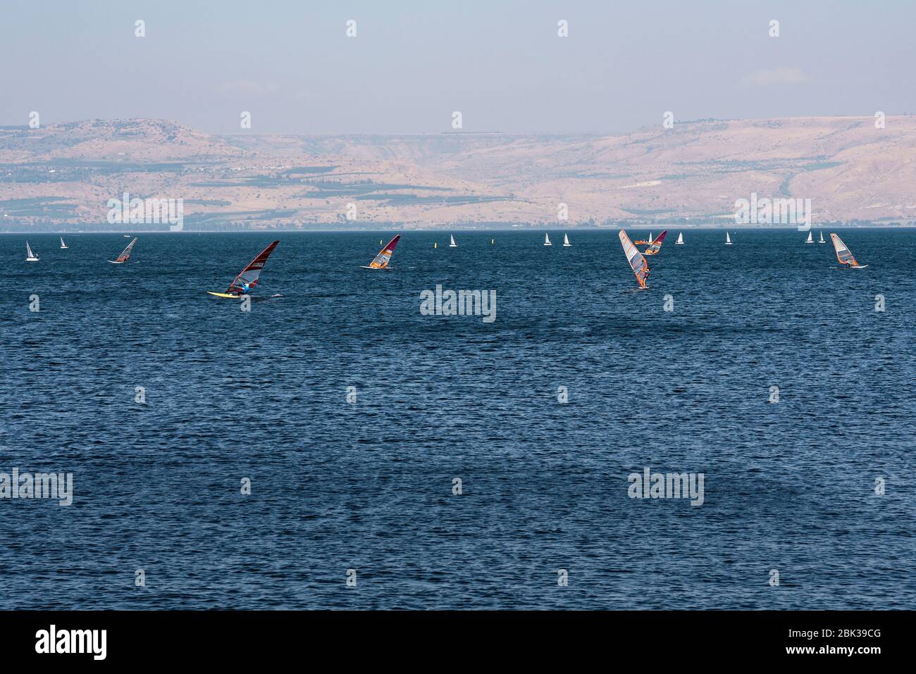 Israel, Sea of Galilee, Windsurfers sailing near the north shore of the ...