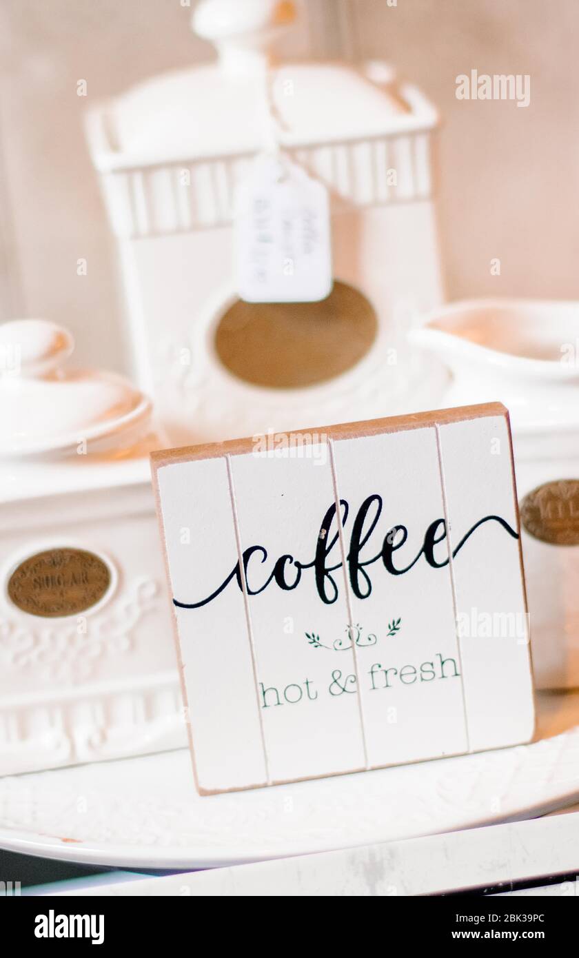 Three white coffee jars with hand lettering coffee sign Stock Photo - Alamy