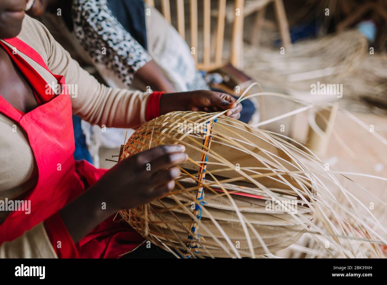 Woman weaving basked out of bamboo in Rwanda Africa Stock Photo - Alamy