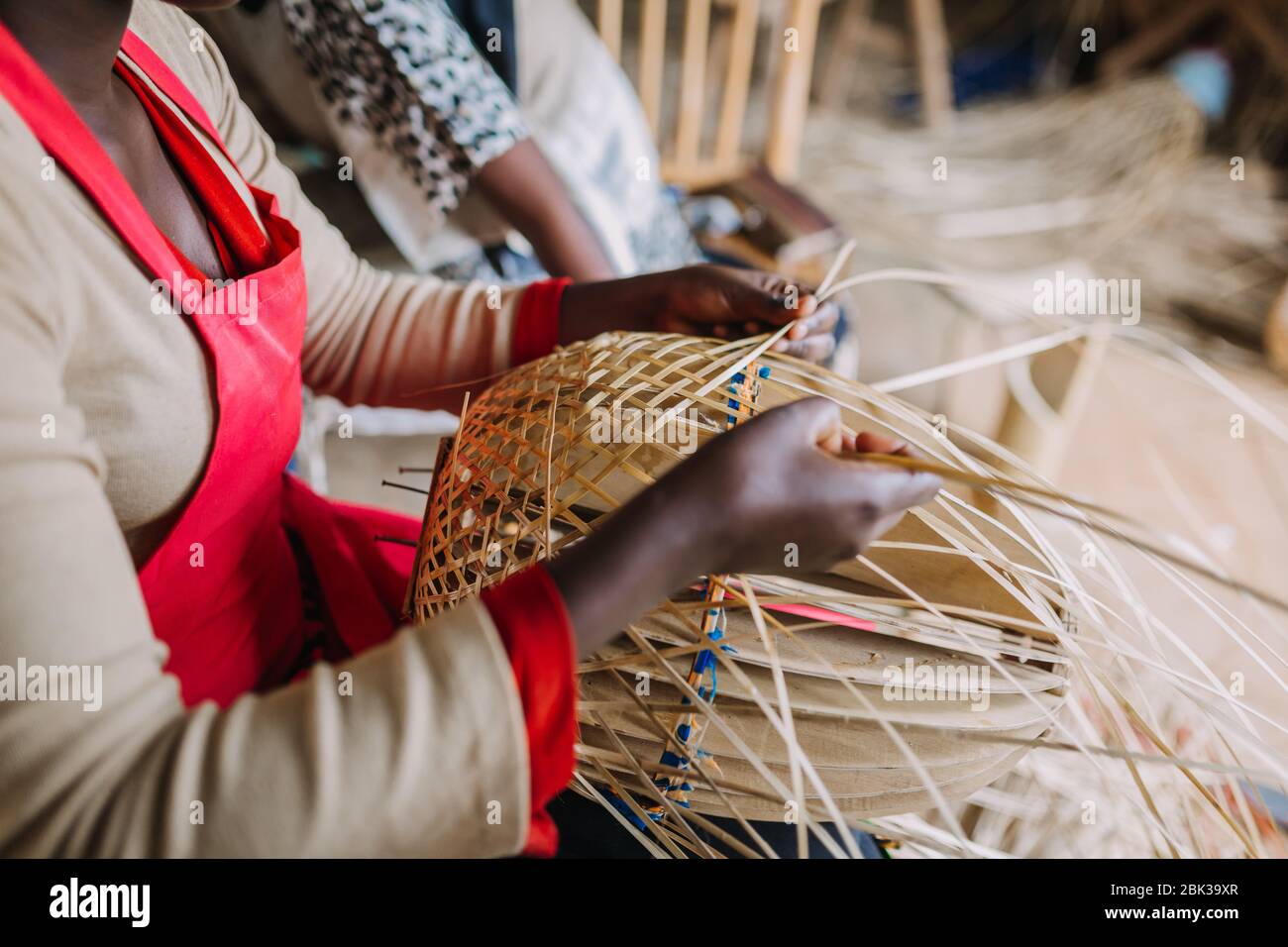 Woman weaving basked out of bamboo in Rwanda Africa Stock Photo - Alamy
