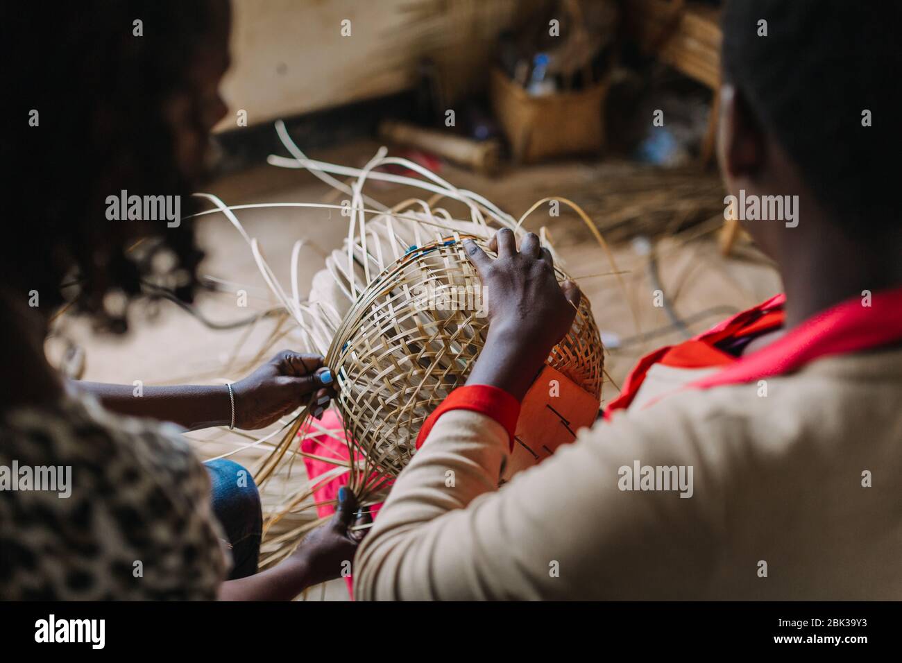 Woman weaving basked out of bamboo in Rwanda Africa Stock Photo - Alamy