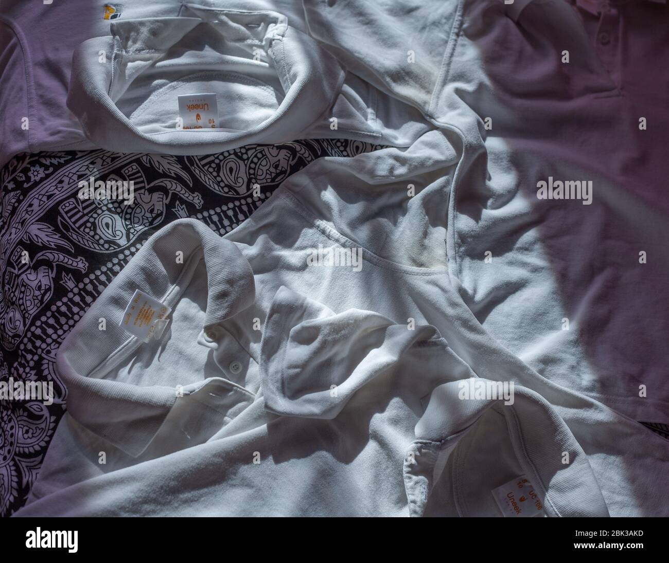 School uniform washed and lying on the bed Stock Photo - Alamy