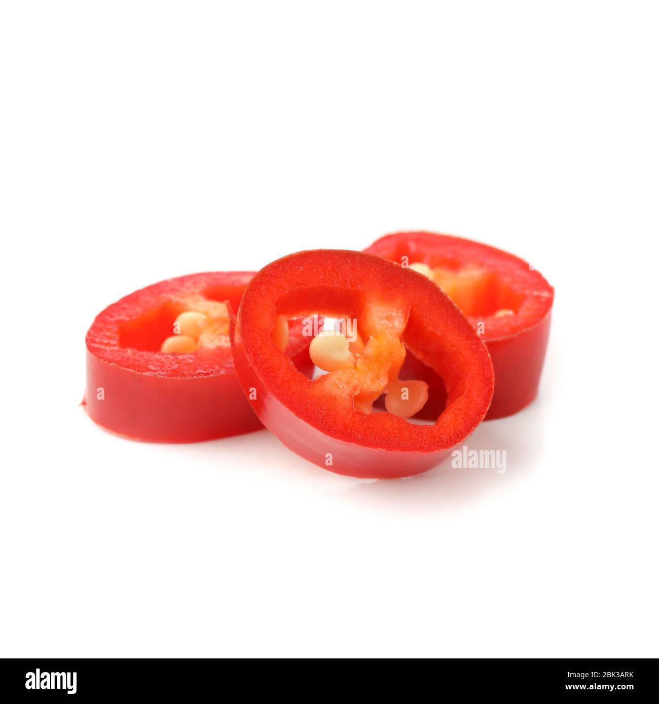 Chilli pepper slices isolated on white background Stock Photo - Alamy