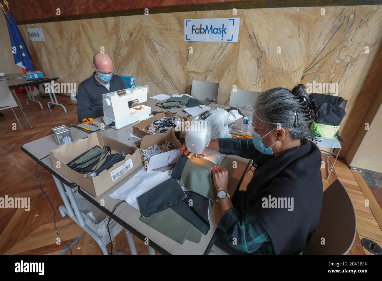 VOLUNTEERS ARE MAKING CLOTH MASK IN A TOWN HALL Stock Photo - Alamy