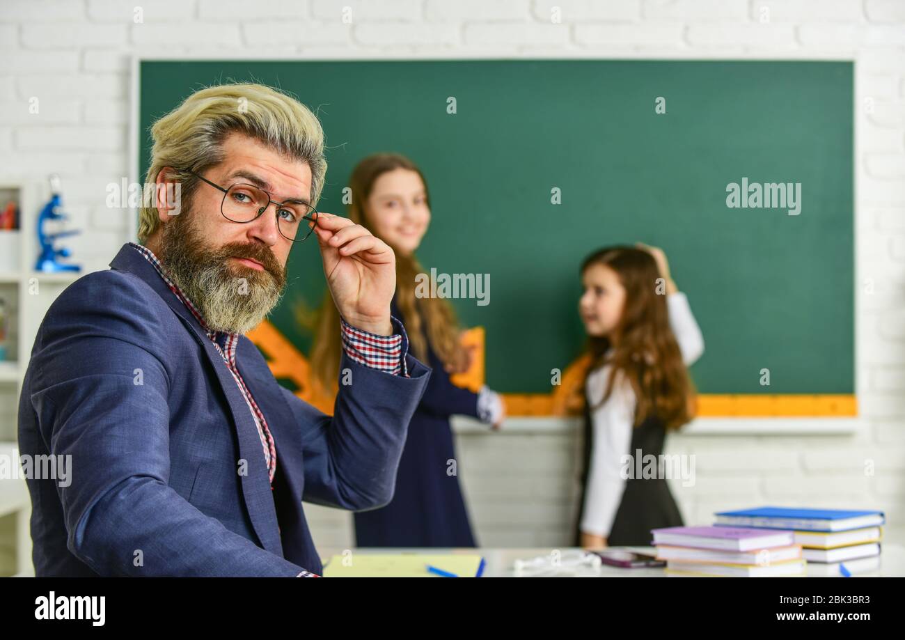 Control process. Pedagogue. Watching them. Teacher and kids Classroom ...