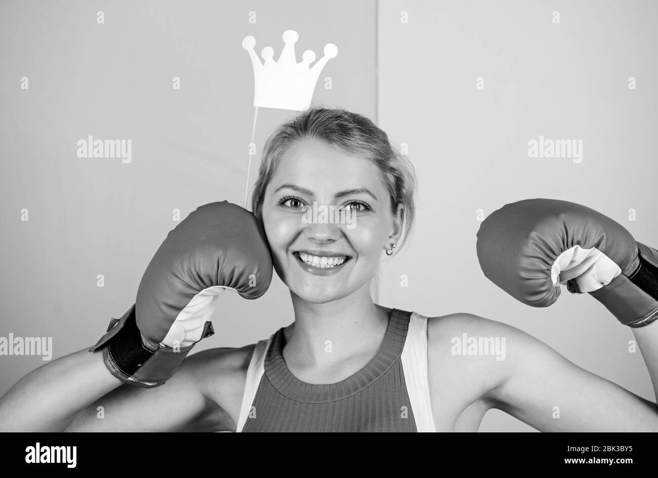 Queen of boxing ring. Sportswoman with princess crown. Cheerful girl ...