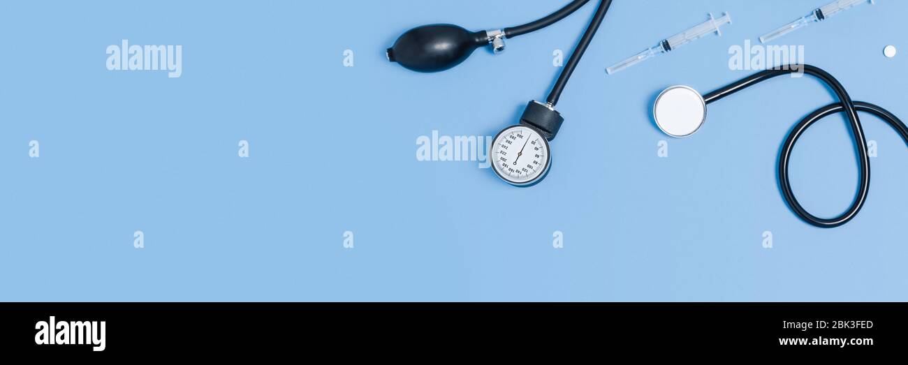 Medical blue background with different accessories: stethoscope ...