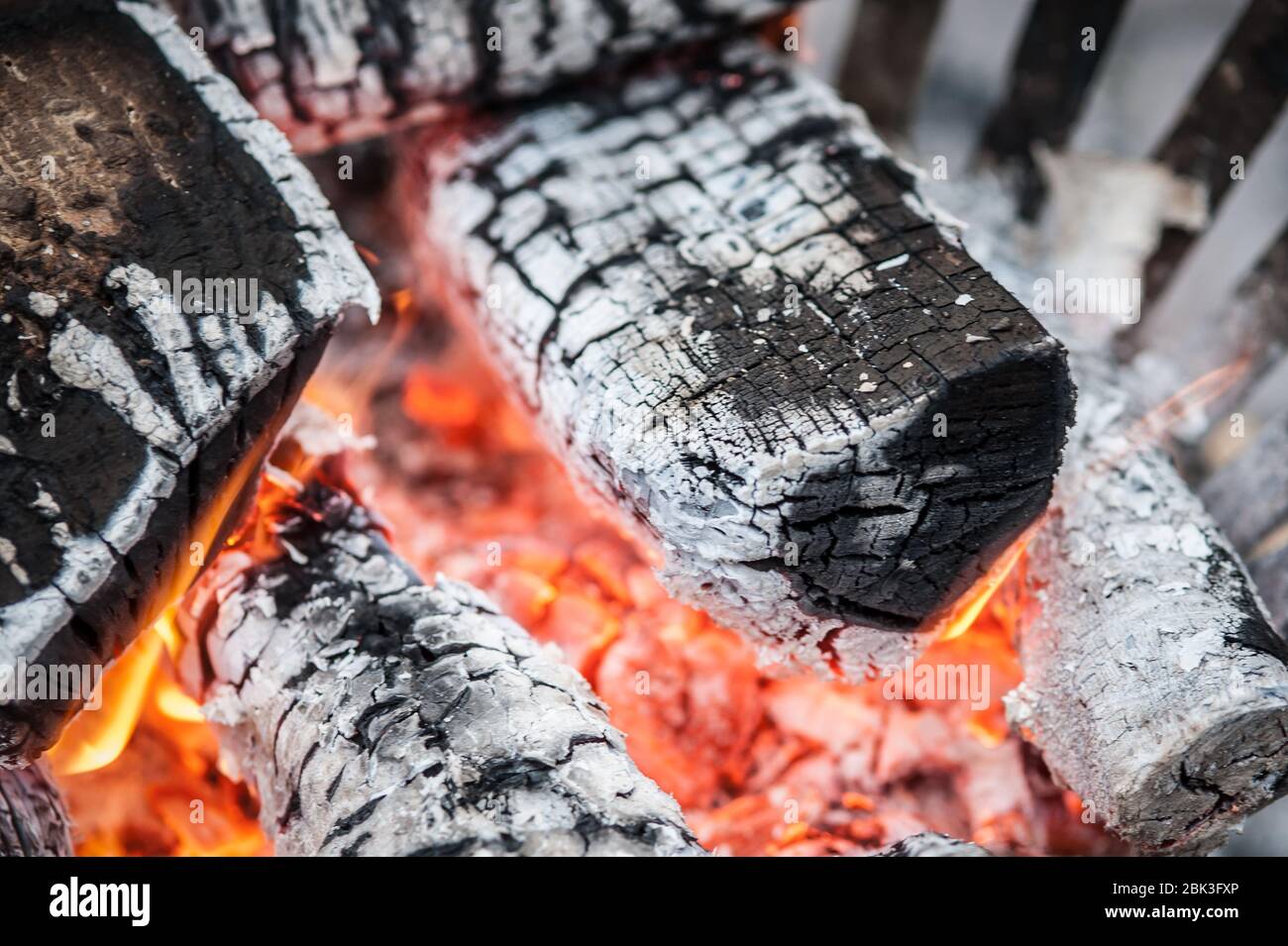 Abstract and artistic close-up detail view of burning wood burns in ...