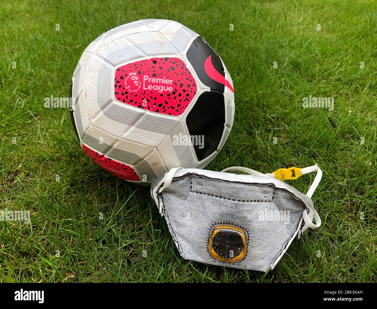 A Premier League Football is dressed with a PPE face mask Stock Photo ...
