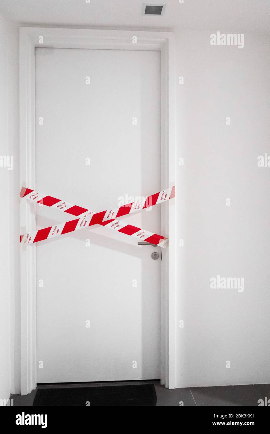 The entrance to the apartment is blocked by a protective tape. Crime ...