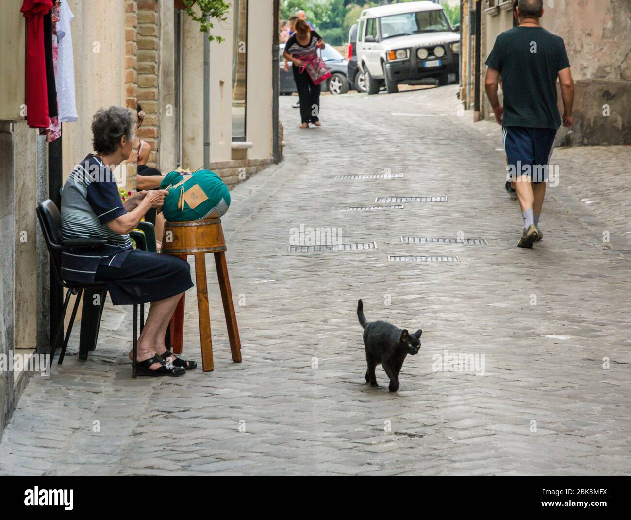 women working the pillowlace in the medieval Village of Offida, Marche ...