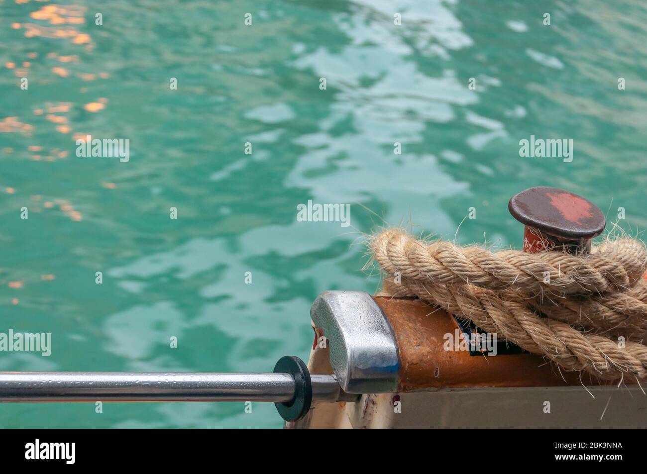 A rope boat with the channel in the background. Venice, Italy Stock ...