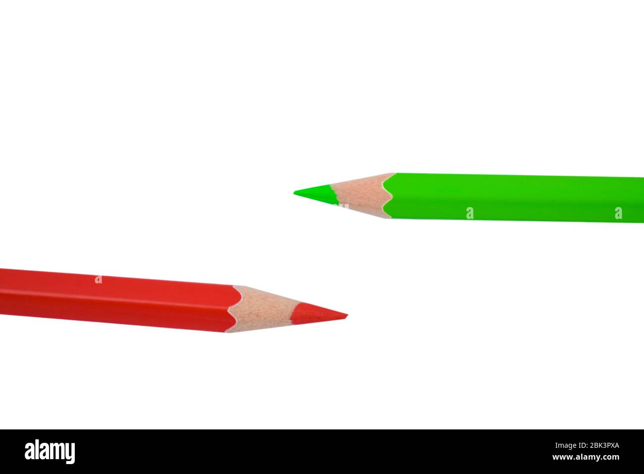 Two different color wood pencil crayons placed on a white isolated ...