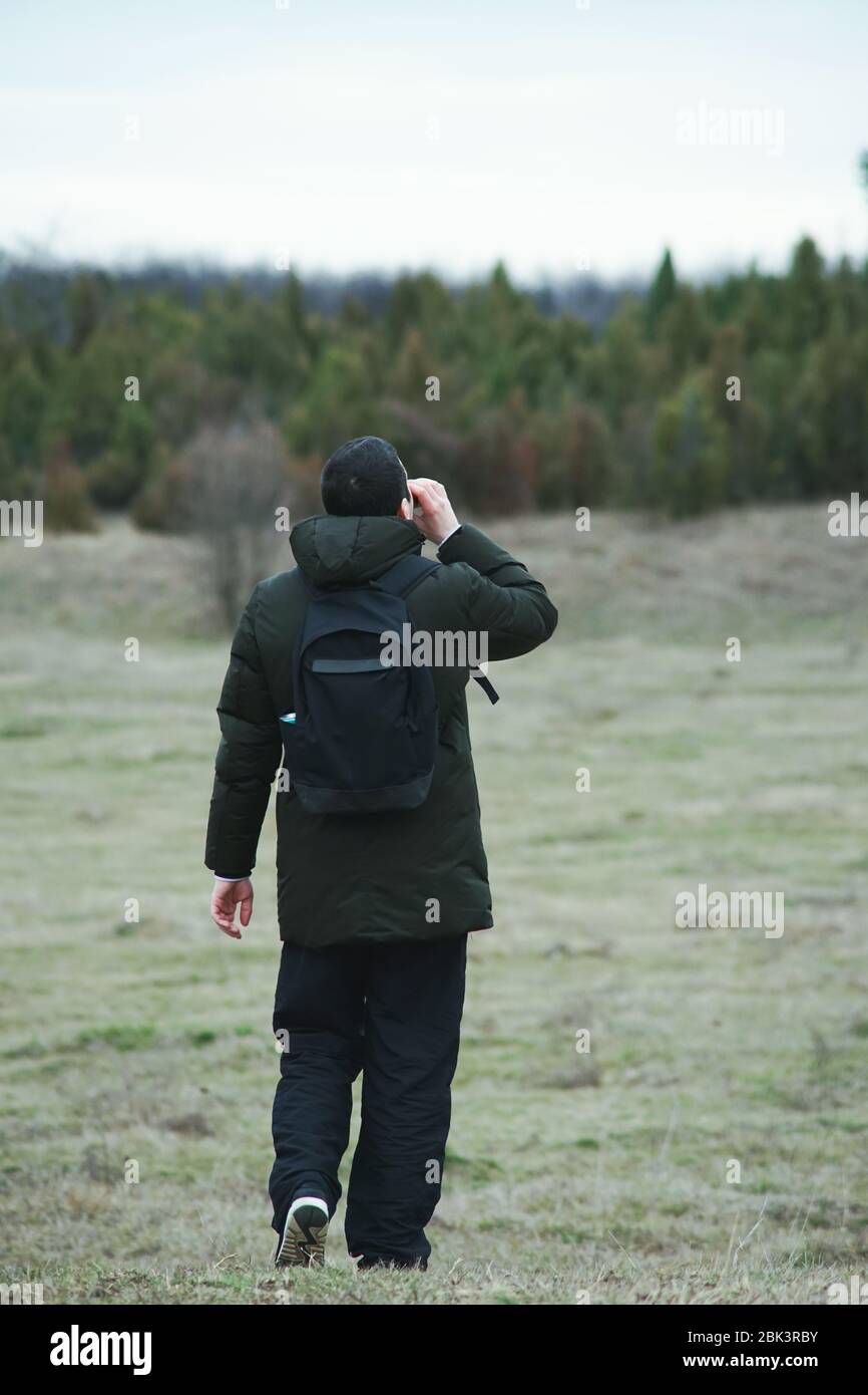Boy with backpack in nature Stock Photo - Alamy