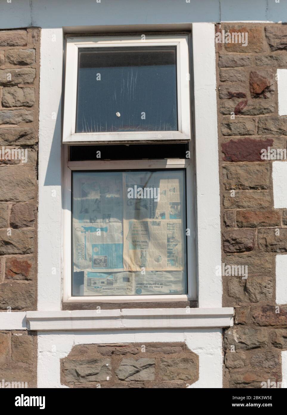Newspaper covered window hi-res stock photography and images - Alamy