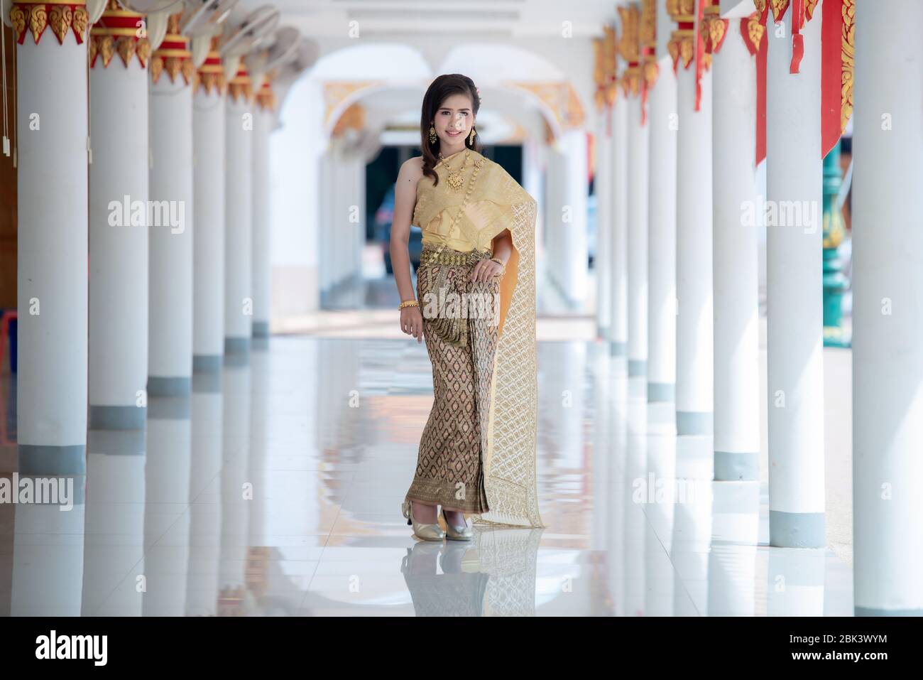 Beautiful Thai girl in traditional dress custume at Temple of Thailand ...