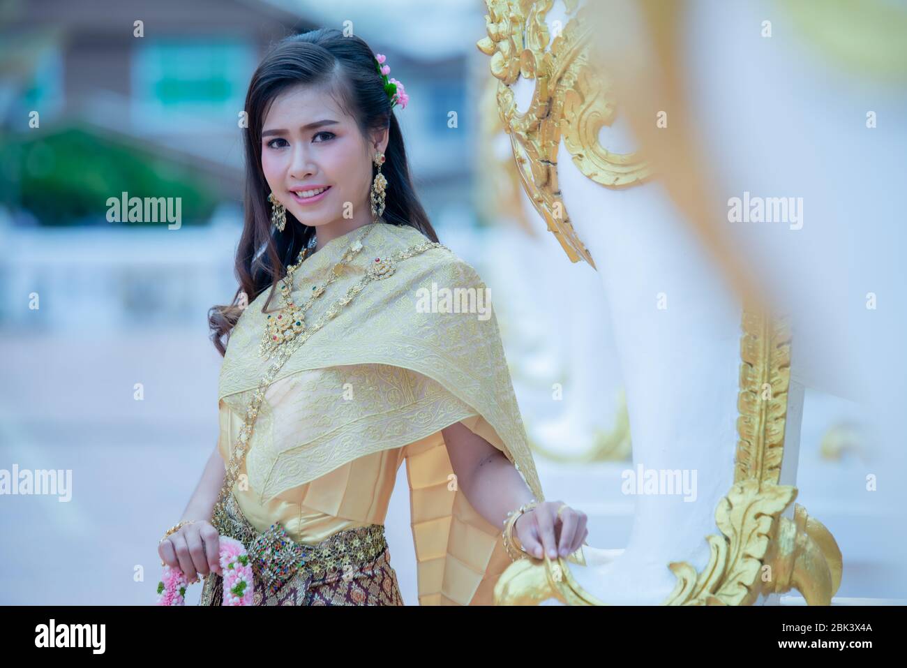 Beautiful Thai girl in traditional dress costume in Phra That Choeng ...