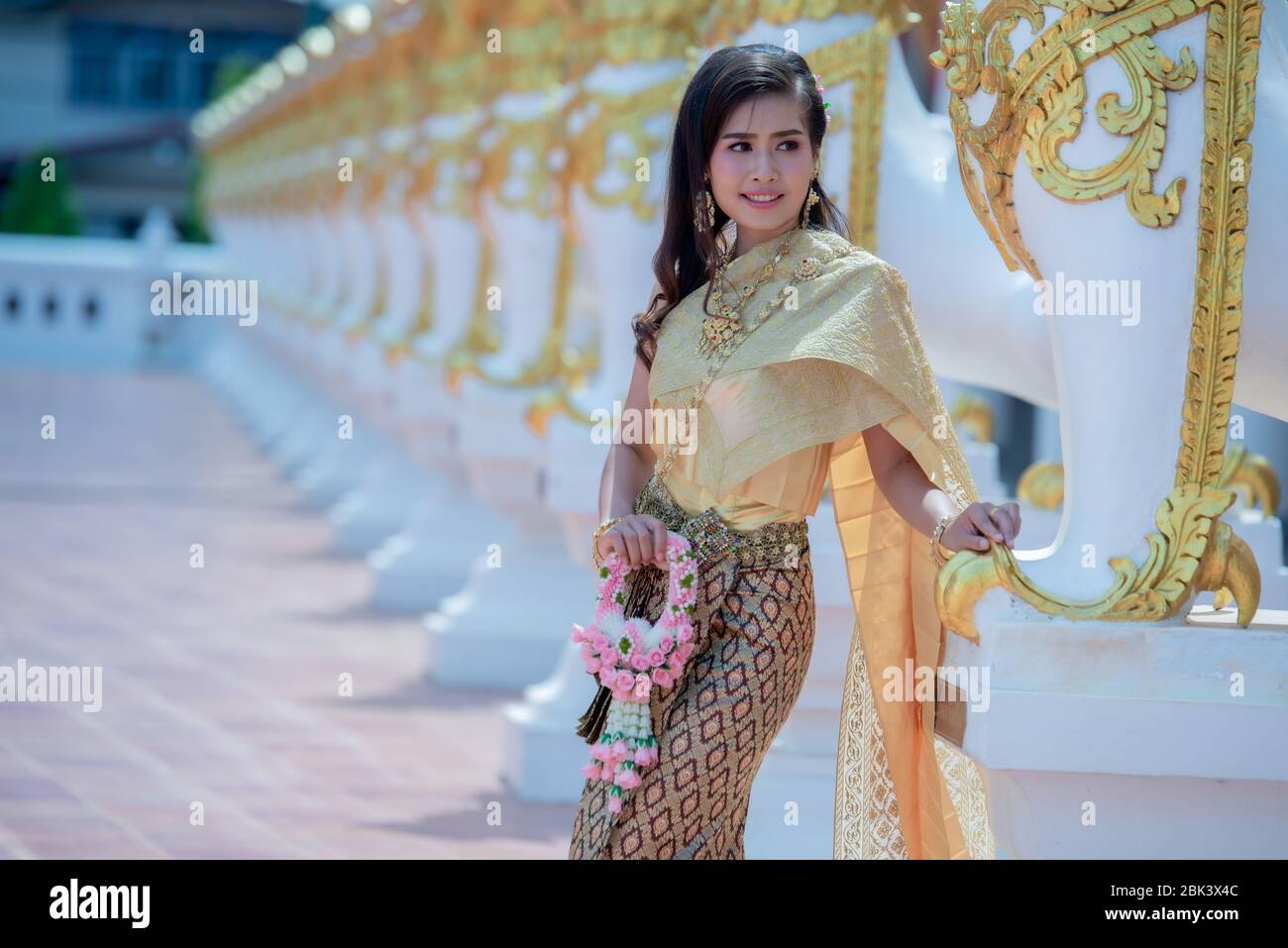 Beautiful Thai girl in traditional dress costume in Phra That Choeng ...