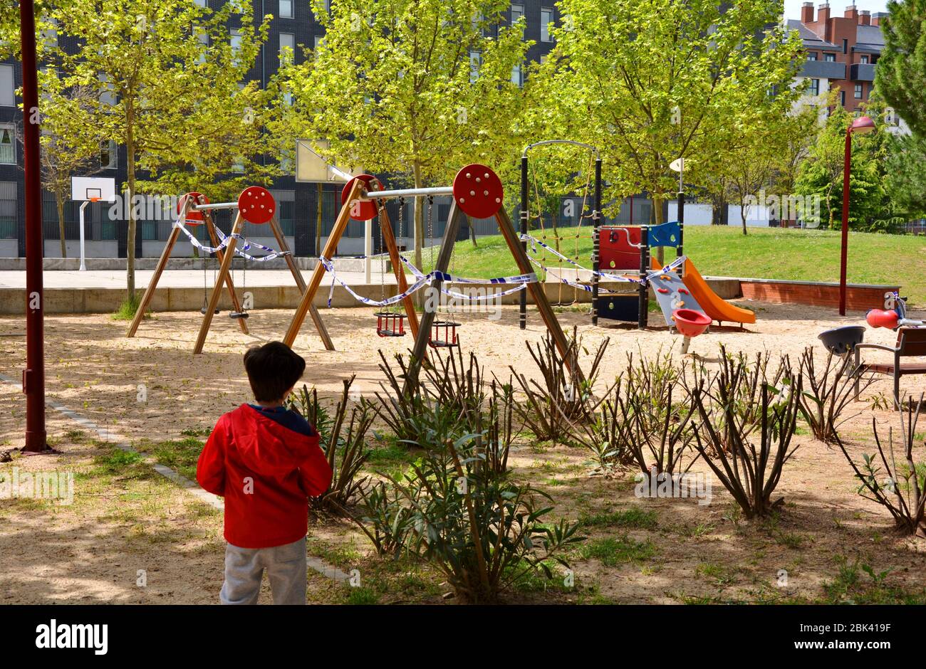 child looking sad a closed playground Stock Photo - Alamy