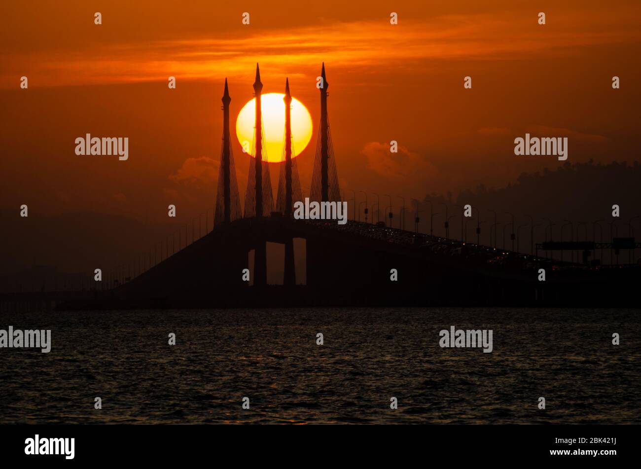 Silhouette Penang Bridge Sunrise with sun yolk Stock Photo - Alamy
