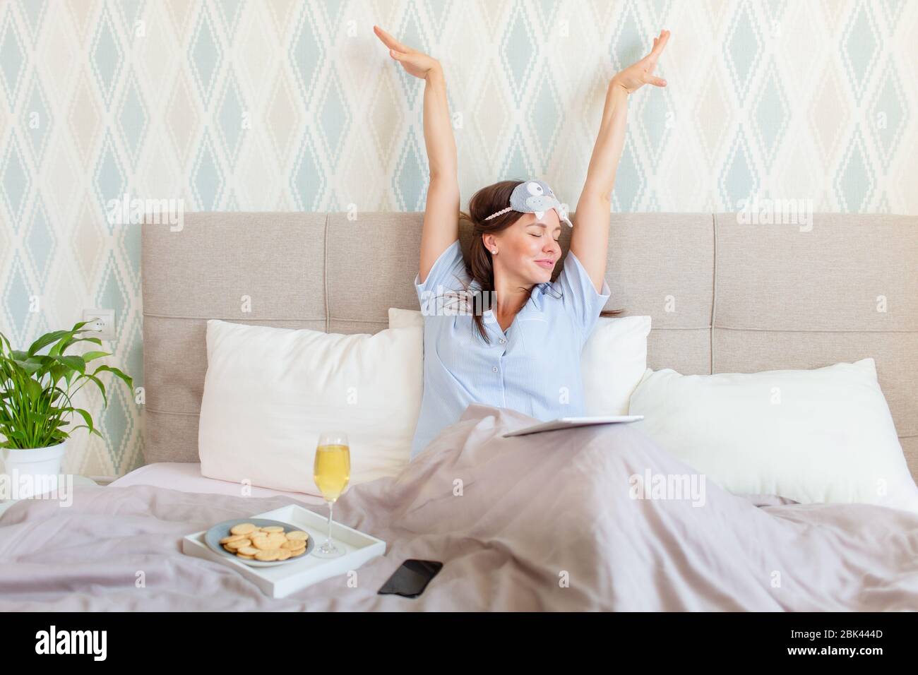 Dark Haired Brunette Woman Wake Up In Her Bed Stretching Up Hands And