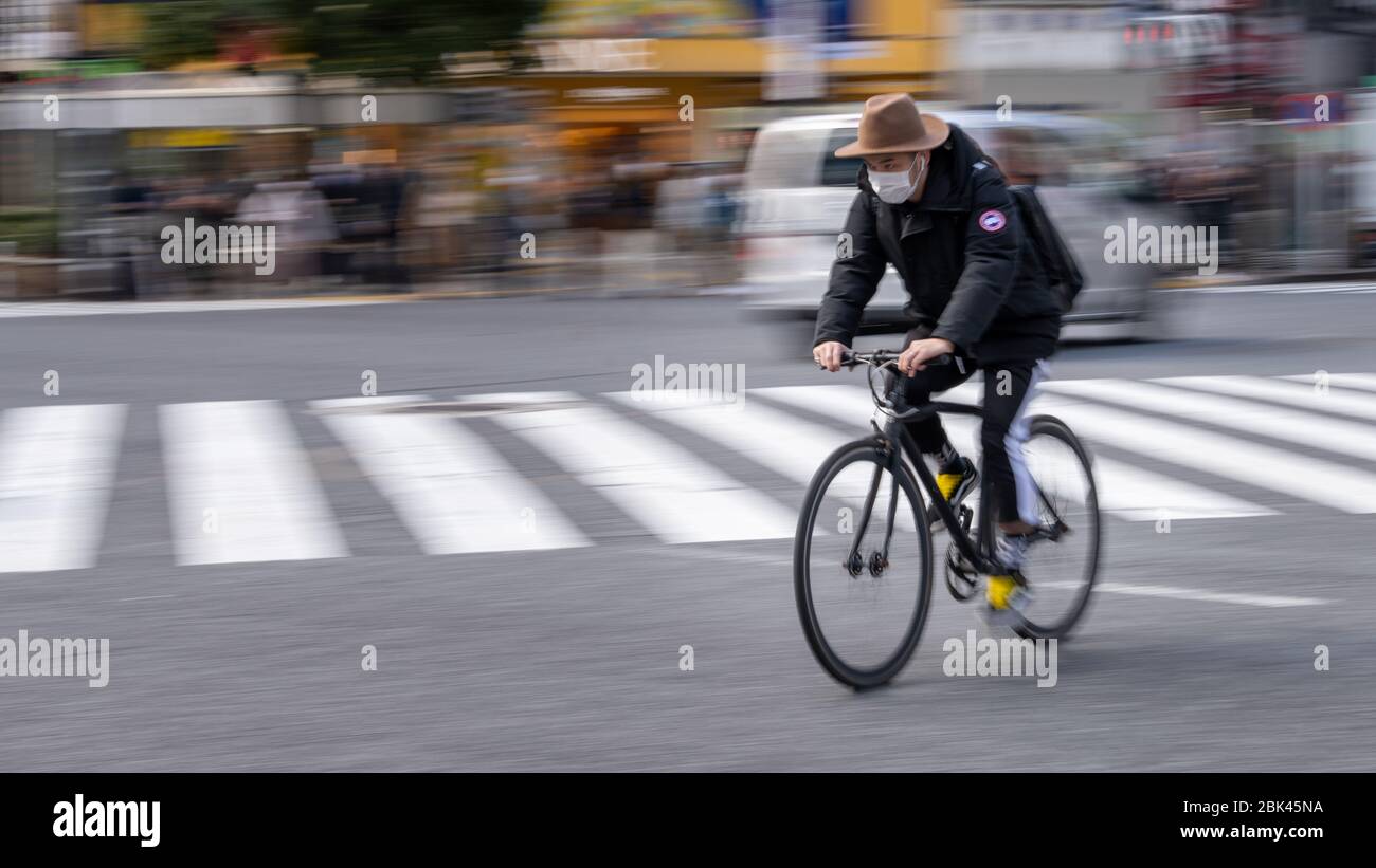 Cyclist Crossing Shibuya, Tokyo, Japan Stock Photo - Alamy
