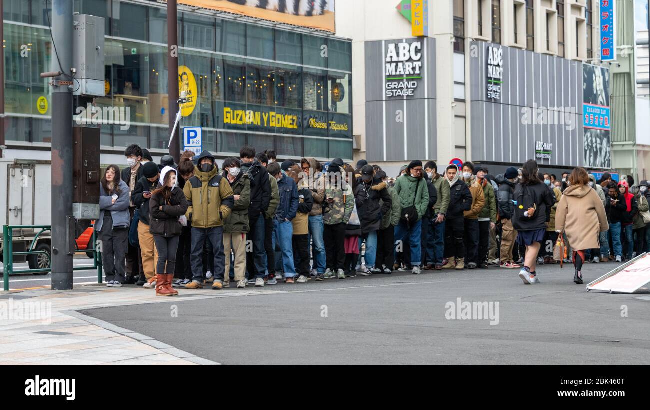 Queue of People in Tokyo, Japan Stock Photo - Alamy