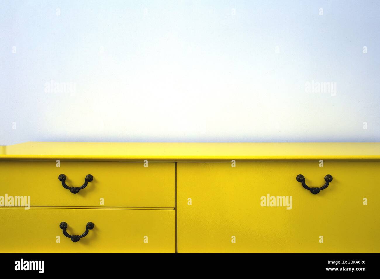 Still life of vintage retro yellow cupboard with white wall, modern ...