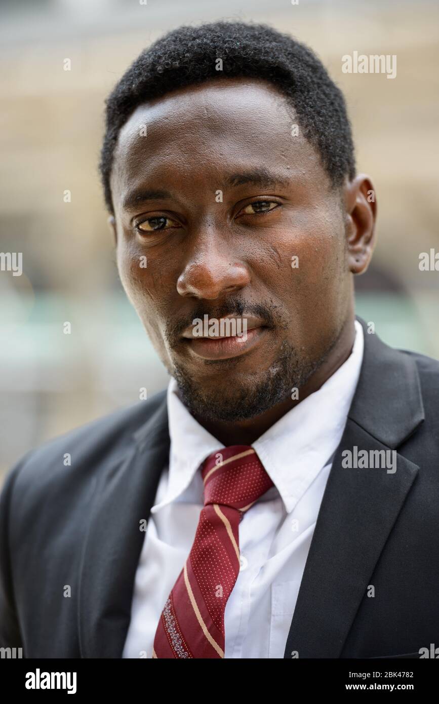 Young black man in suit hi-res stock photography and images - Alamy