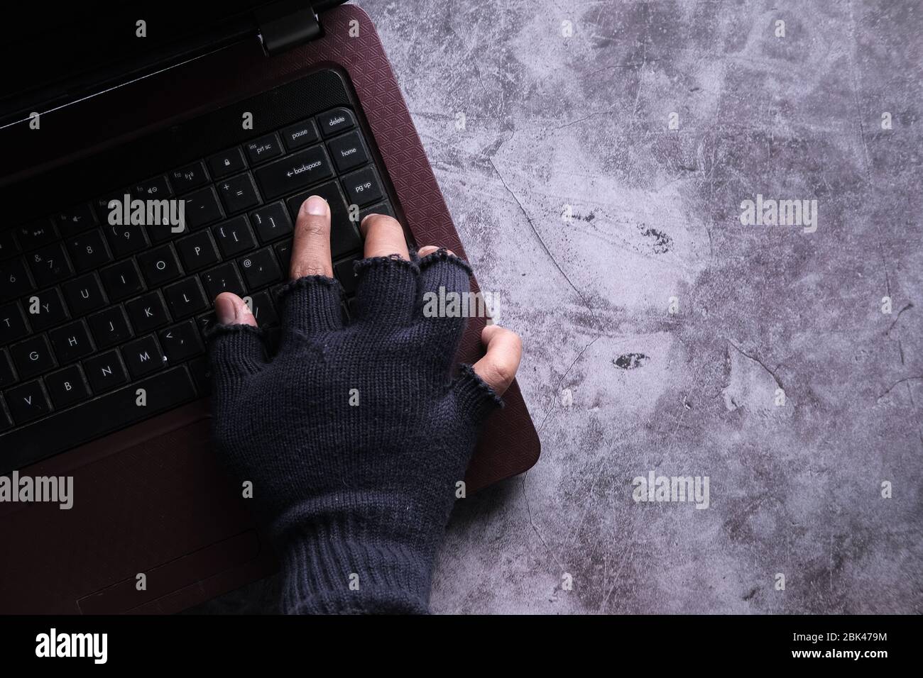 hacker hand stealing data from laptop at night Stock Photo - Alamy
