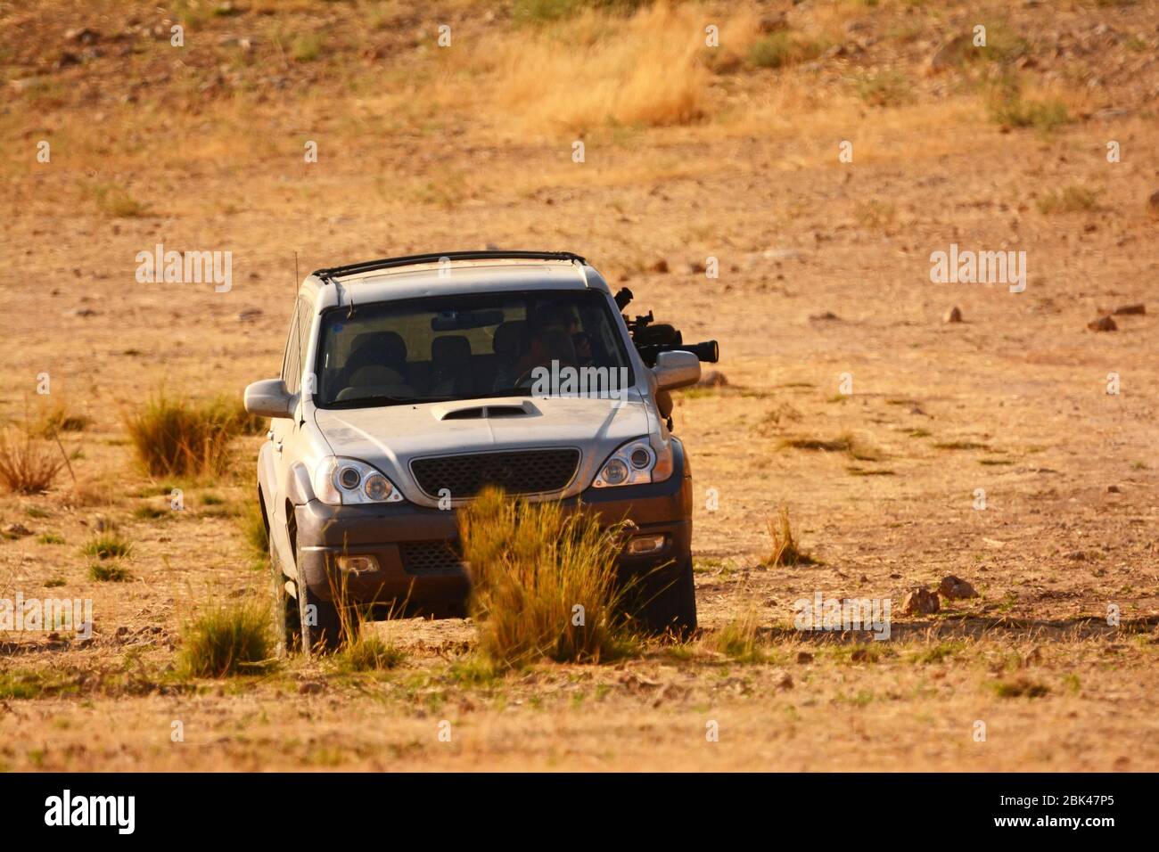 Nature photographers car in the field Stock Photo - Alamy