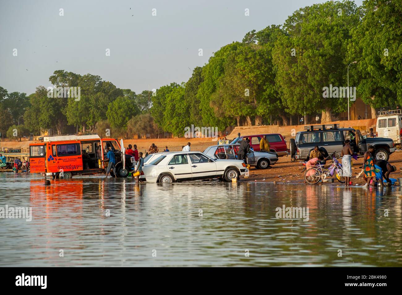 Local people washing their cars on the banks of the Bani River in Mopti ...