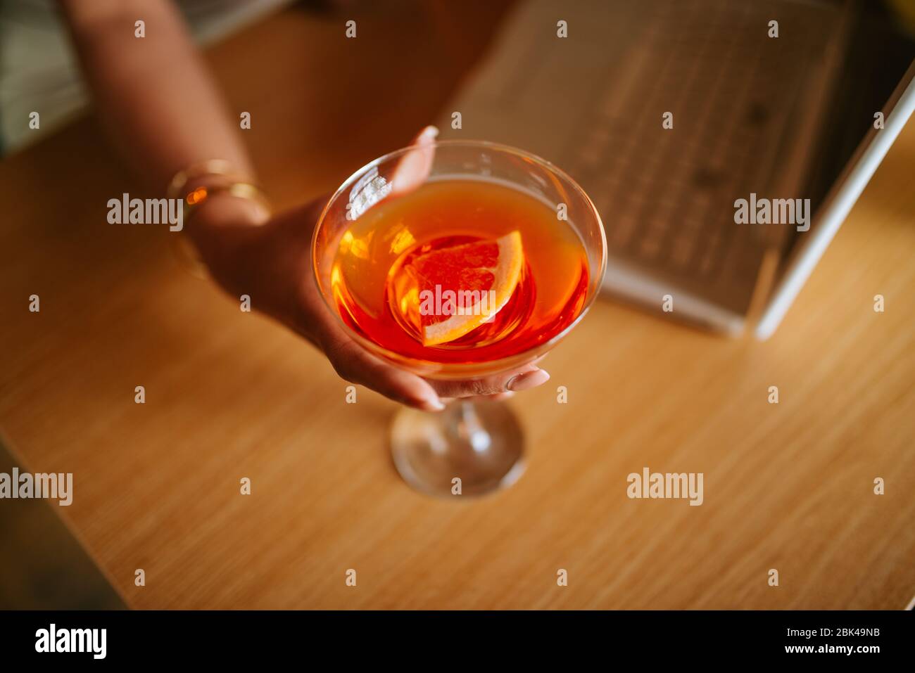 A glass of margarita cocktails and a laptop on the table Stock Photo ...