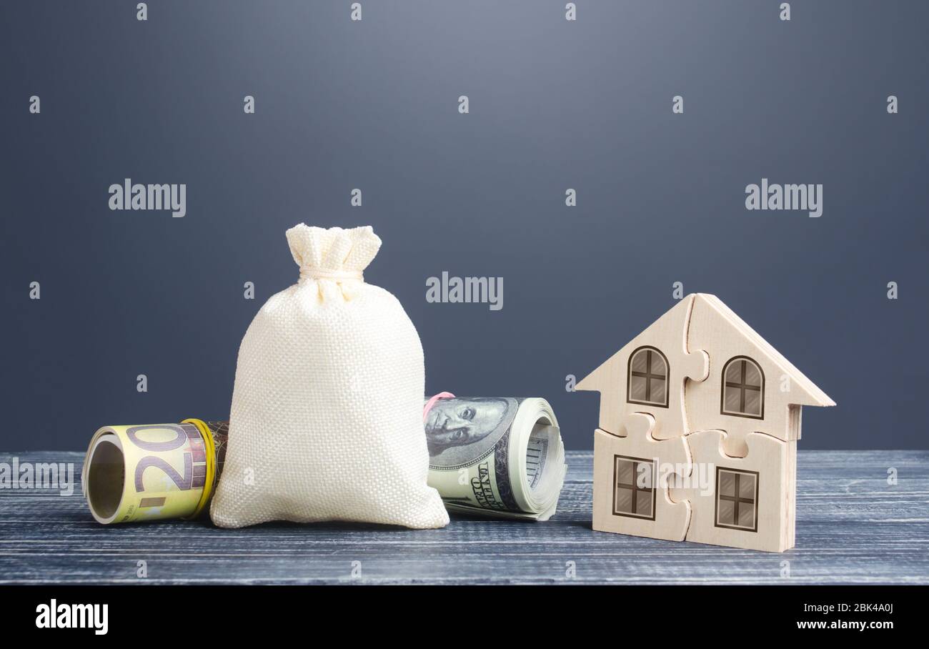 Blank clear money bag and puzzle house. Housing cooperative membership ...