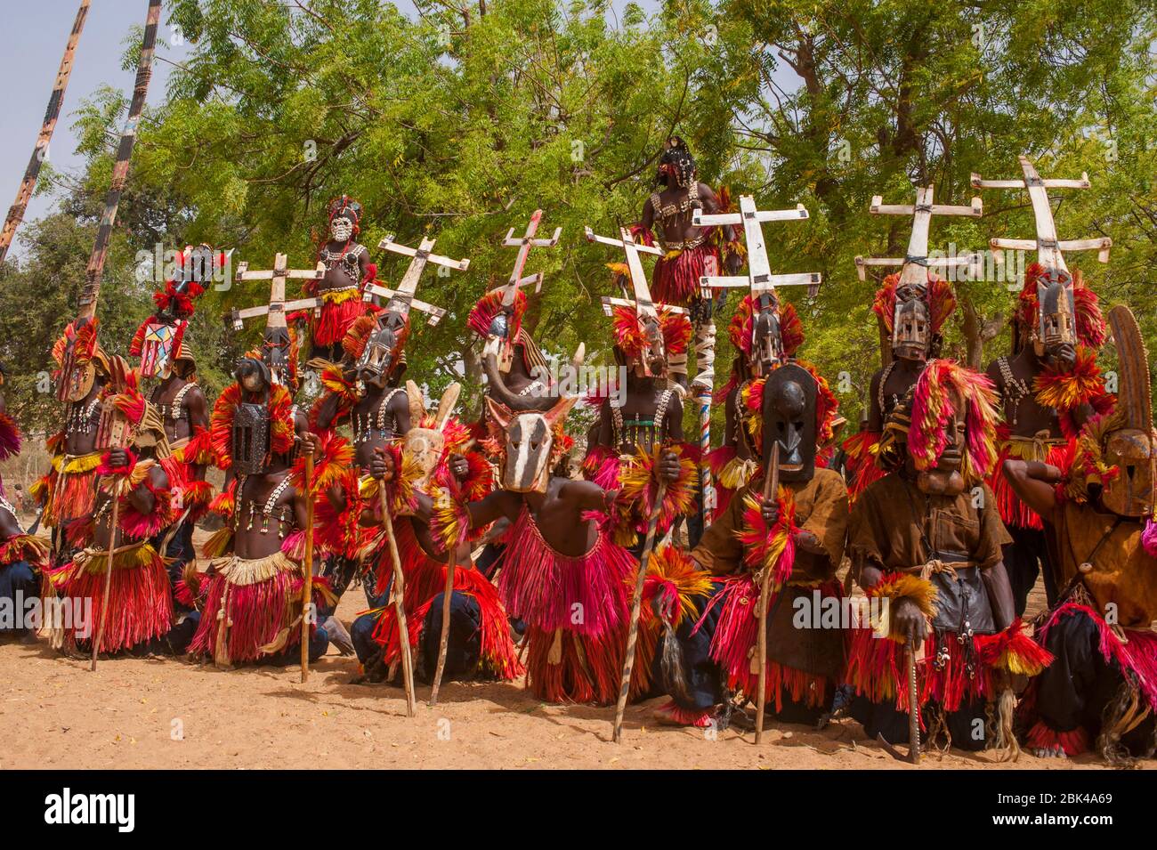 Dogon people (men only) in traditional dance costumes in the village of ...