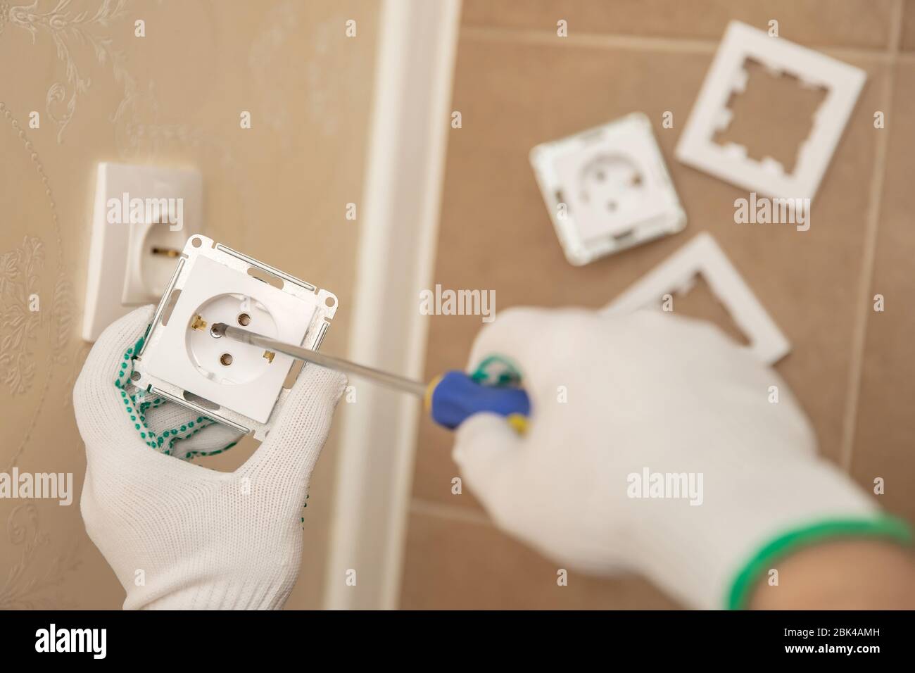 Electrician builder install working switches and sockets black color ...