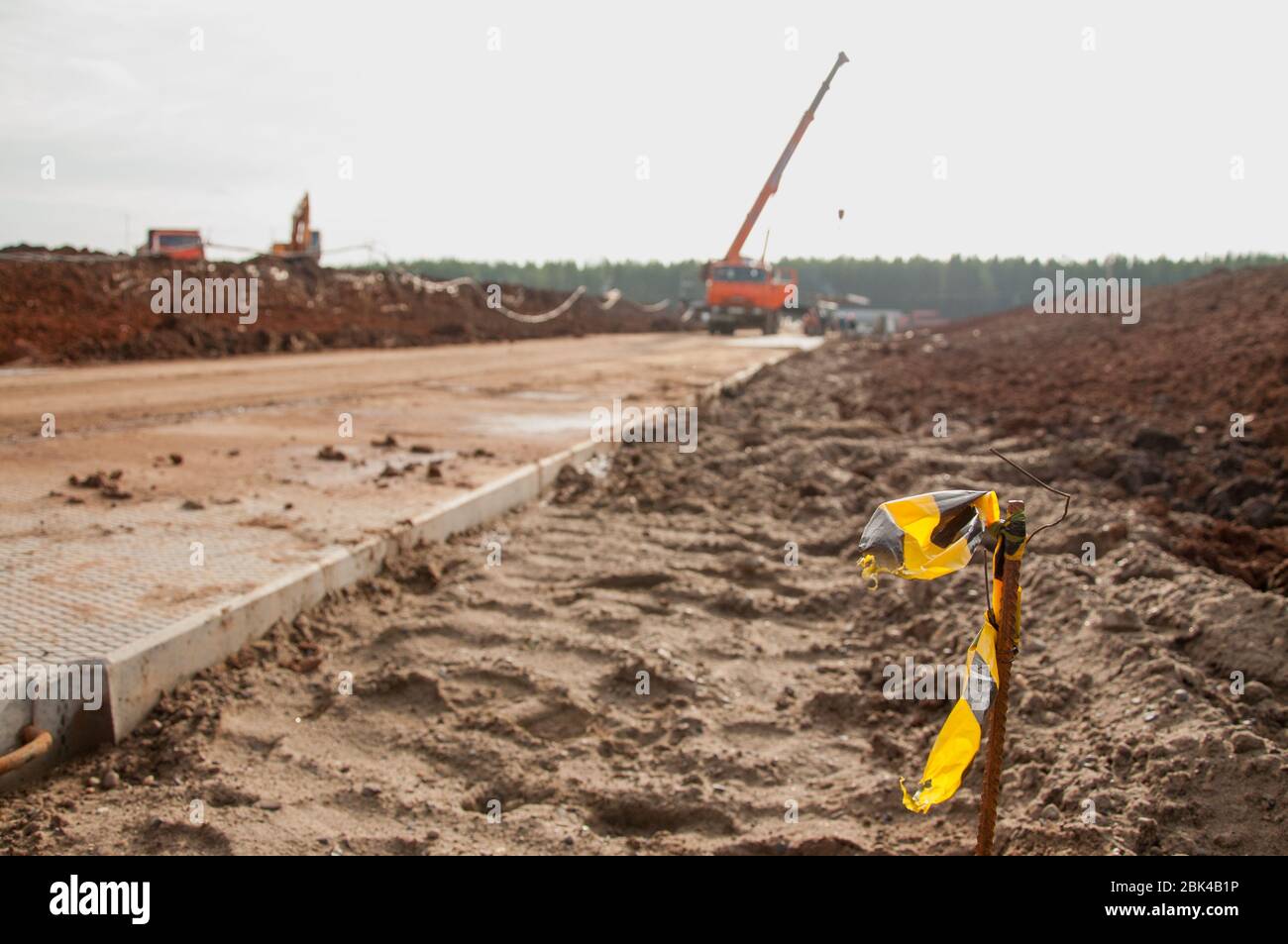 The edge of the road. Part of the road is made of concrete slabs ...