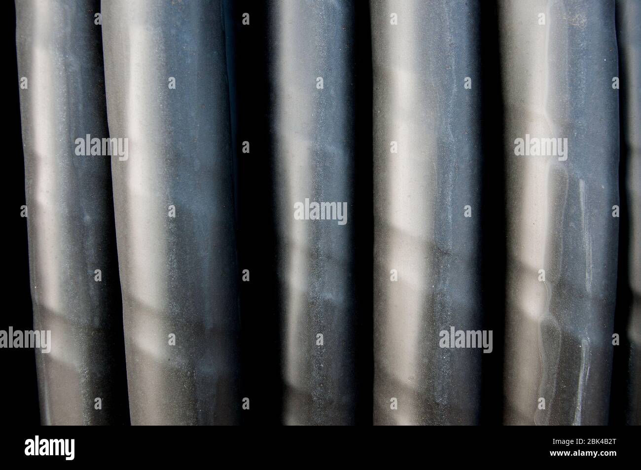 A bay of black Large diameter electric cable. Electric tools for ...