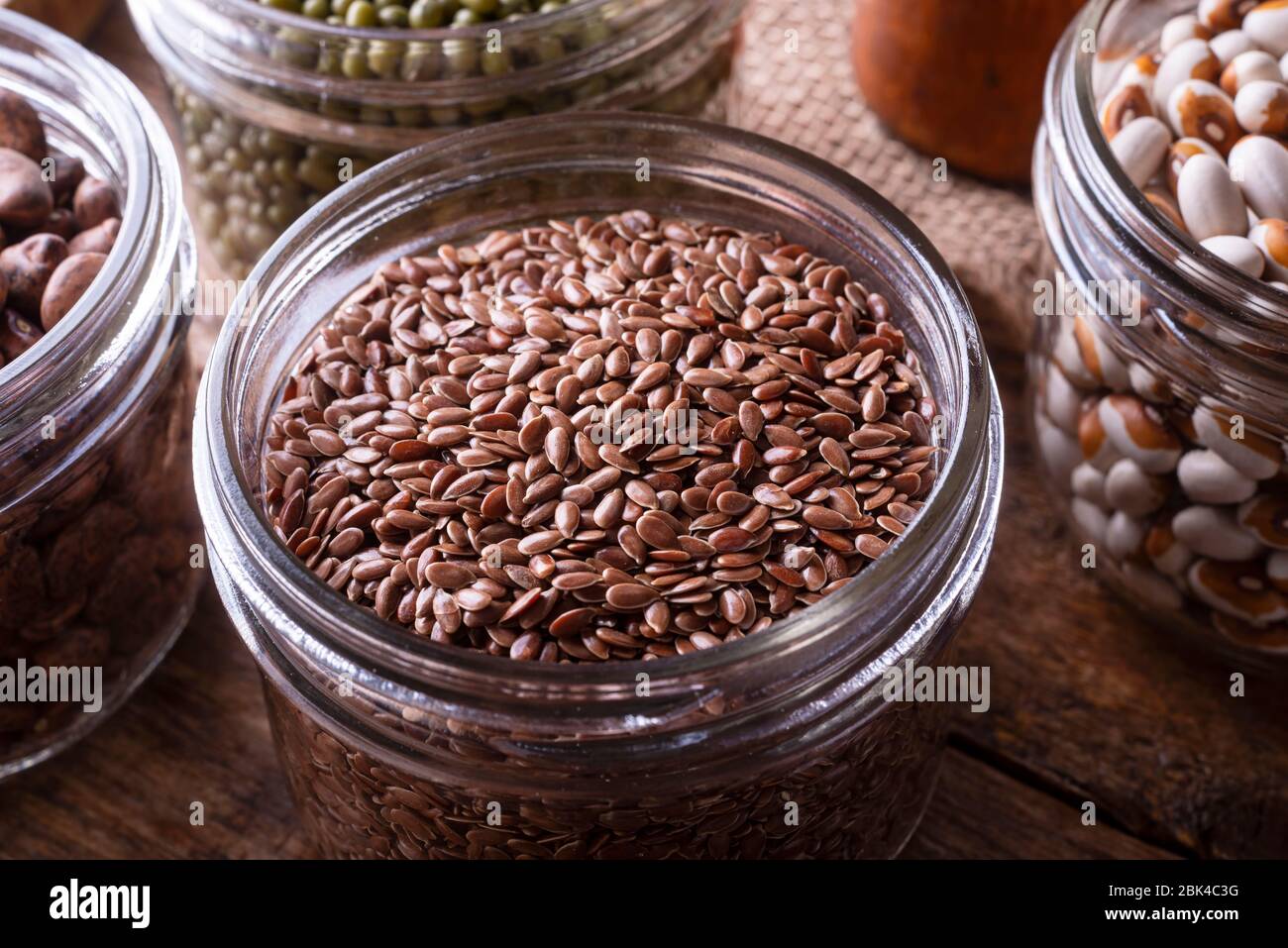 Brown flax seeds in a glass storage container Stock Photo - Alamy