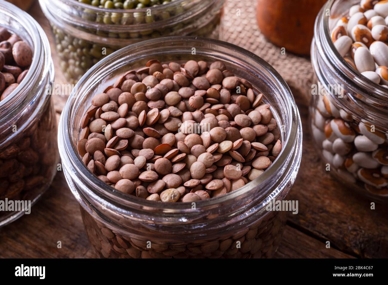 Green lentils in a glass storage container Stock Photo - Alamy