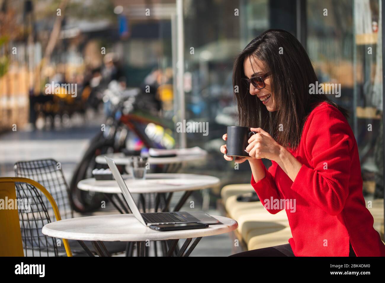 Beautiful young woman having Zoom video conference call via computer ...