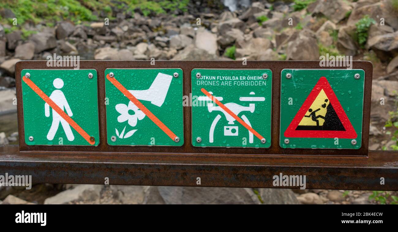 Warning signs in front of the Svartifoss (Black Falls) waterfall ...