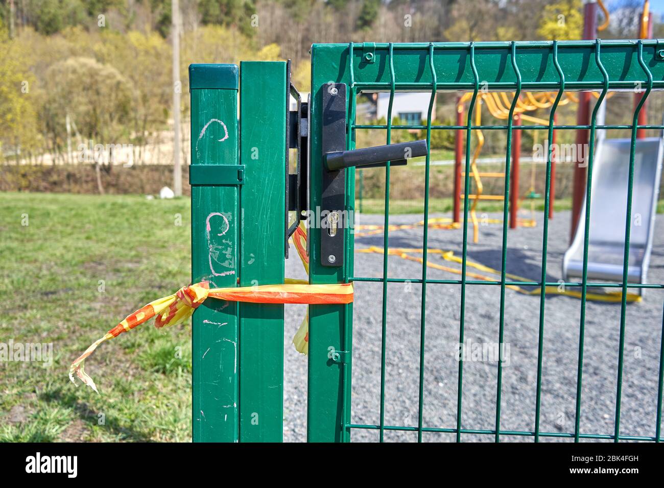 Closed gate to the children playground due to virus threat Stock Photo ...