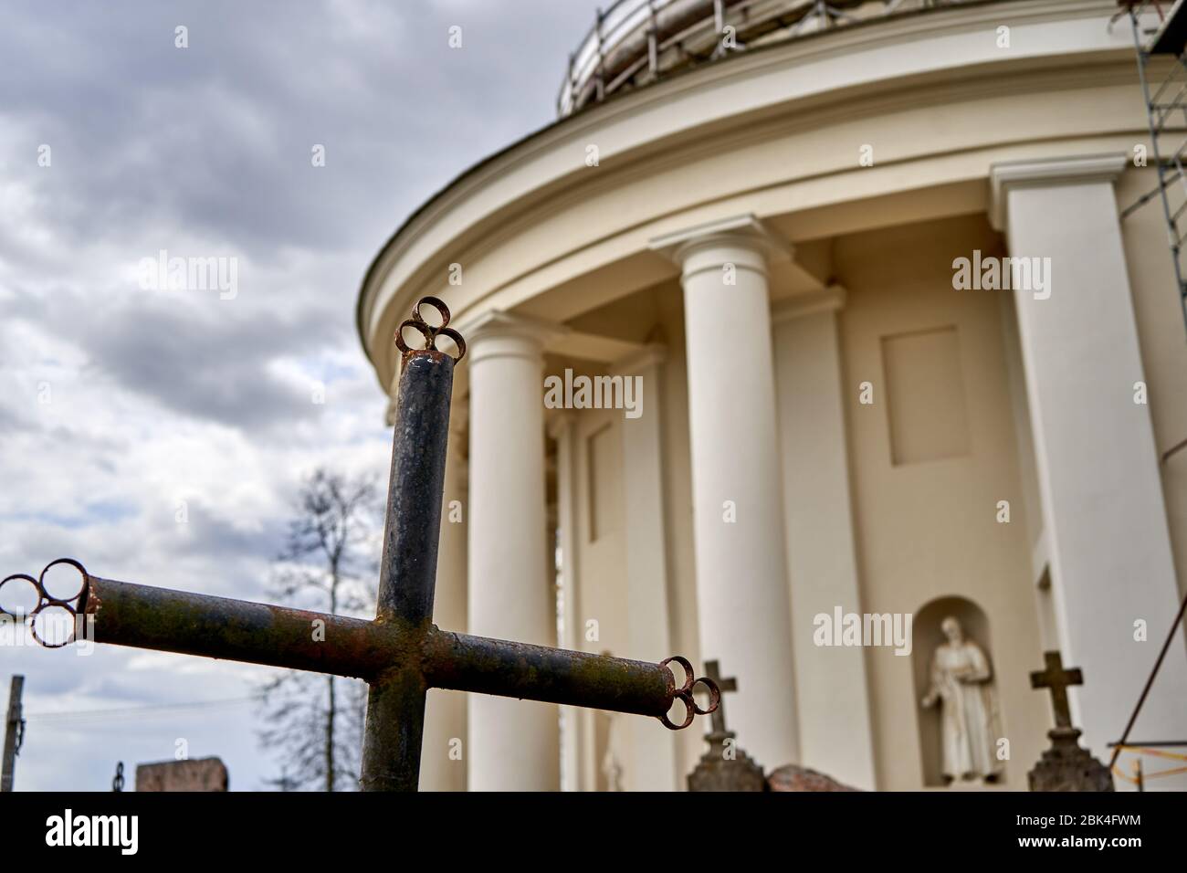 Old metal cross near the huge church with pillars Stock Photo - Alamy