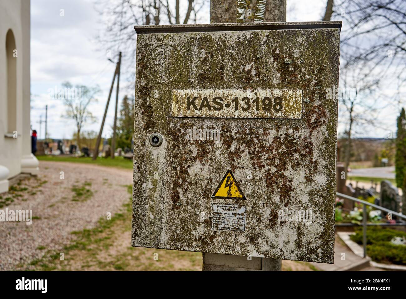Old and dirty electrical box hanging on the pole Stock Photo - Alamy