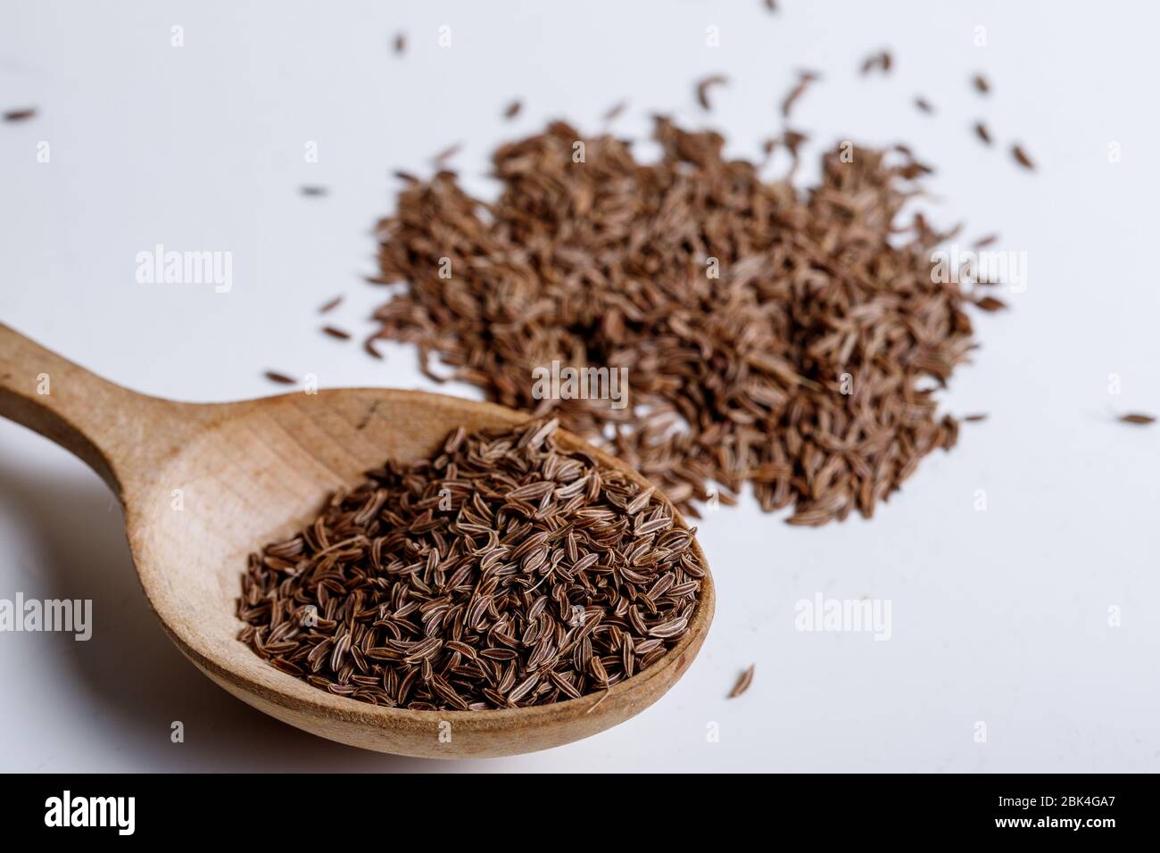 Pile of cumin seeds isolated on white background Stock Photo - Alamy