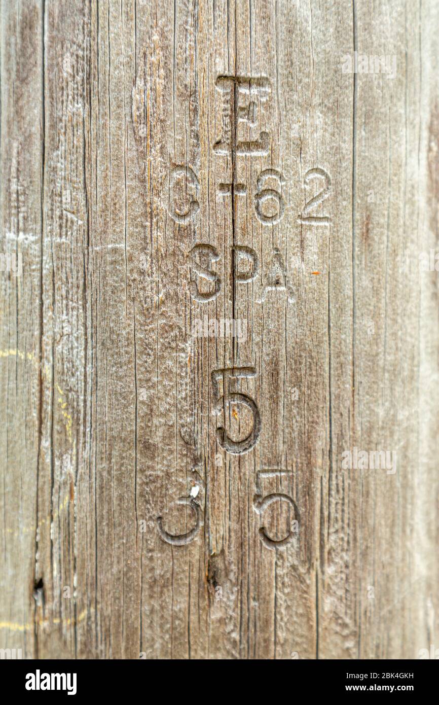 detail image stamped numbers and marks on an electrical pole Stock ...