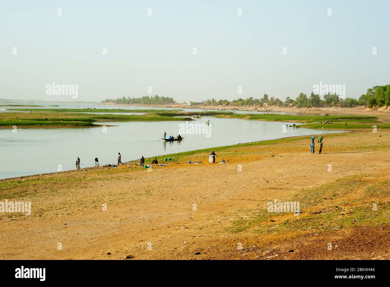 People in wooden canoes on the Bani River in Mopti in Mali, West Africa ...