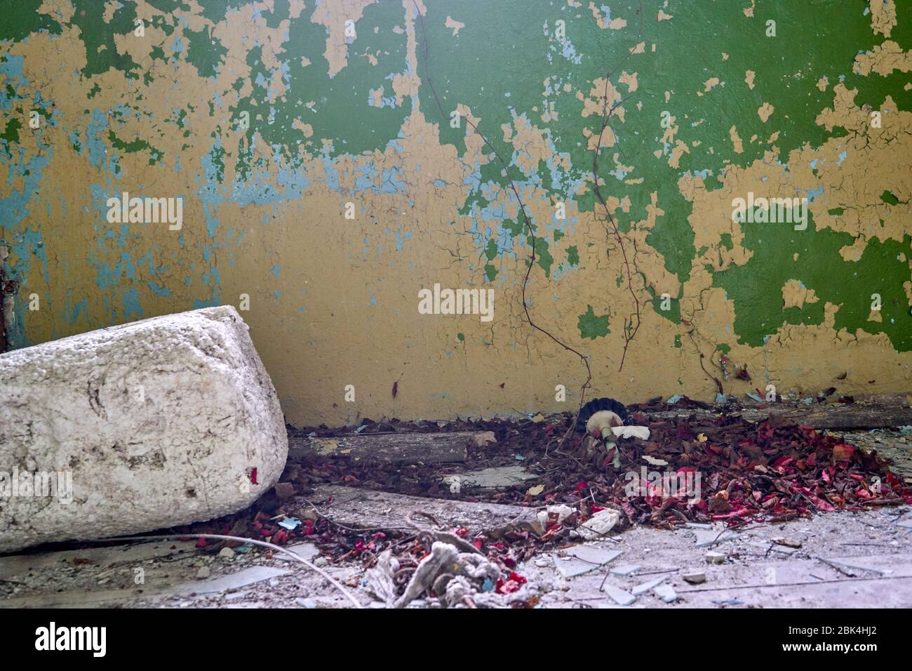 Paint started to fall off in old abandoned building Stock Photo - Alamy