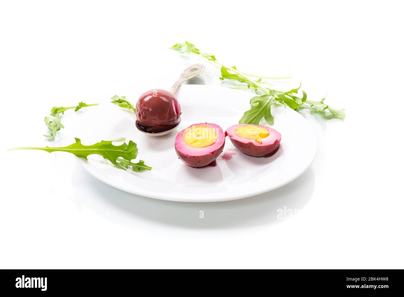 marinated chicken eggs in beetroot marinade in a plate Stock Photo - Alamy